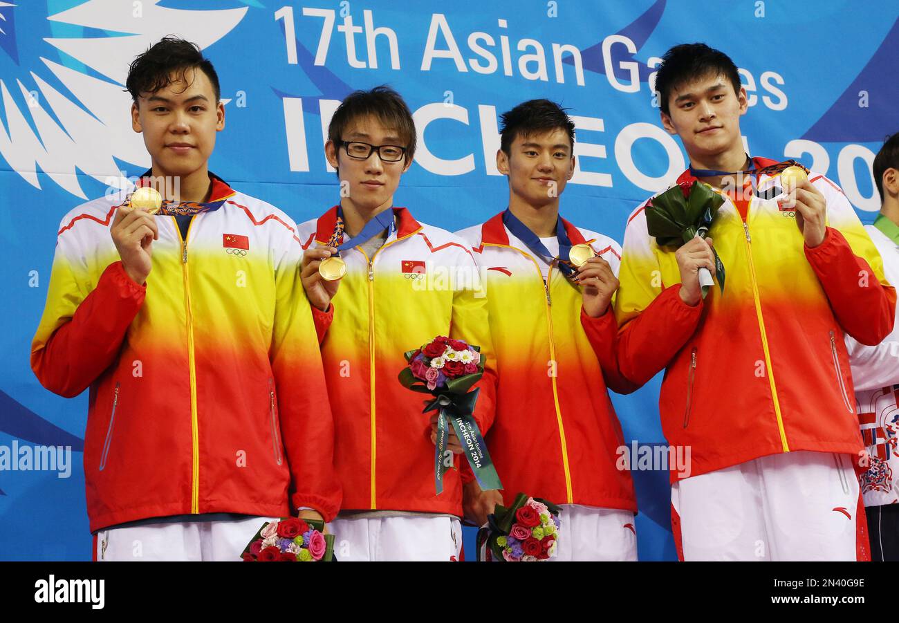 China's men's 4 x100-meter freestyle relay team, from left, Yu Hexin, Lin Yongging, Ning Zetao ...