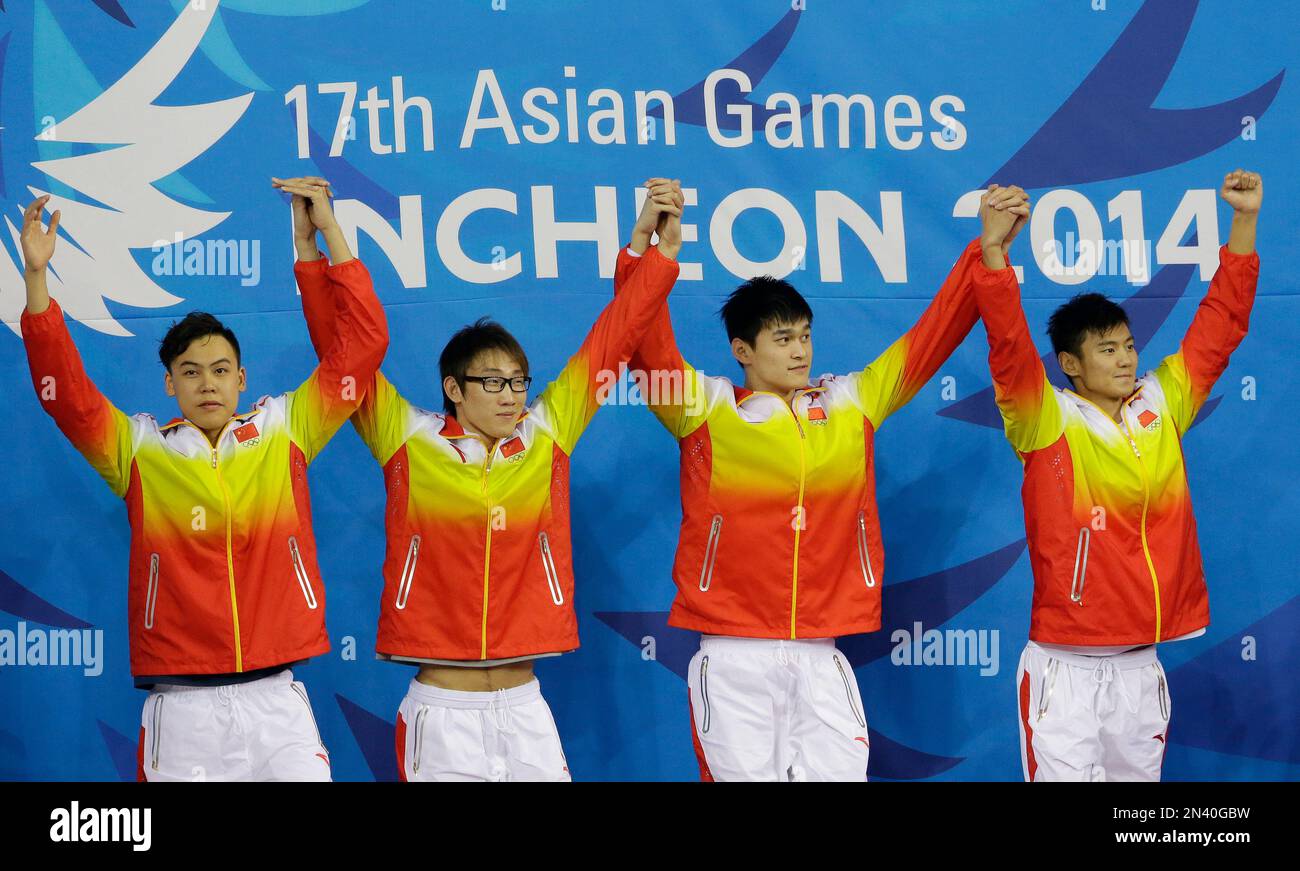 China's men's 4 x100-meter freestyle relay team, from left, Yu Hexin ...