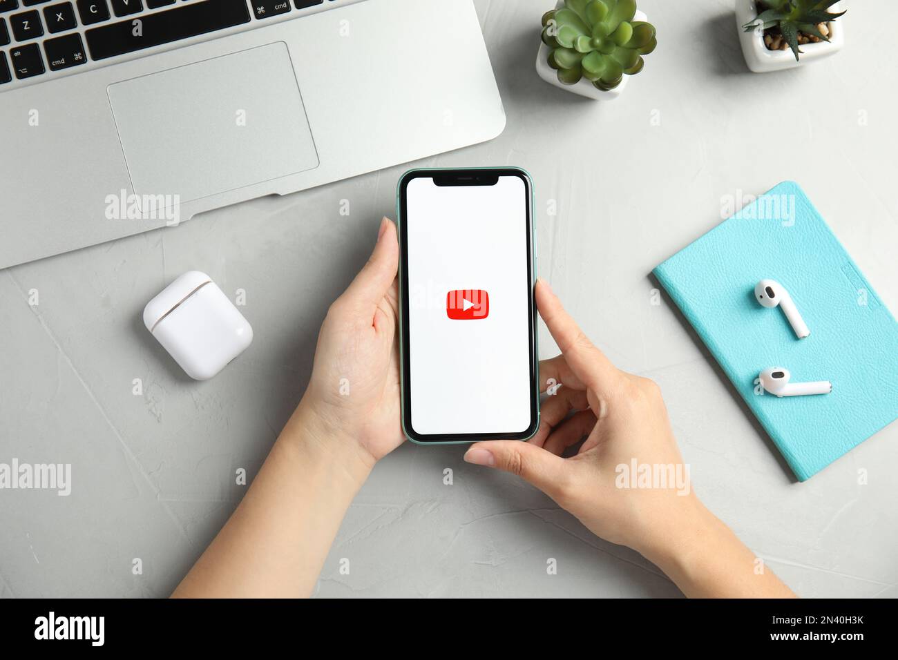 MYKOLAIV, UKRAINE - JULY 10, 2020: Woman holding Iphone 11 with Youtube ...