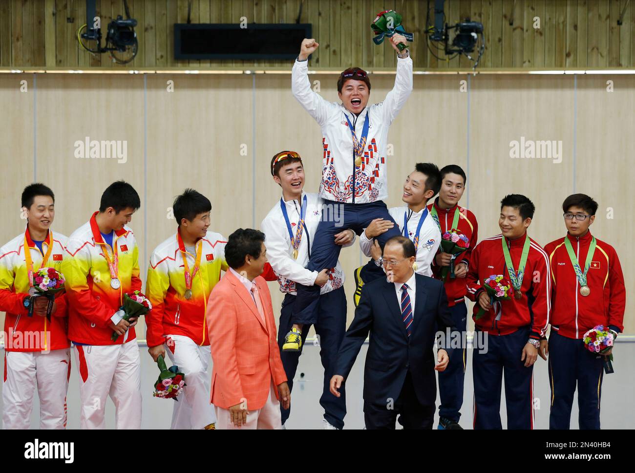 From left, silver medal winners China team, gold medal winners South Korea team and bronze medal ...
