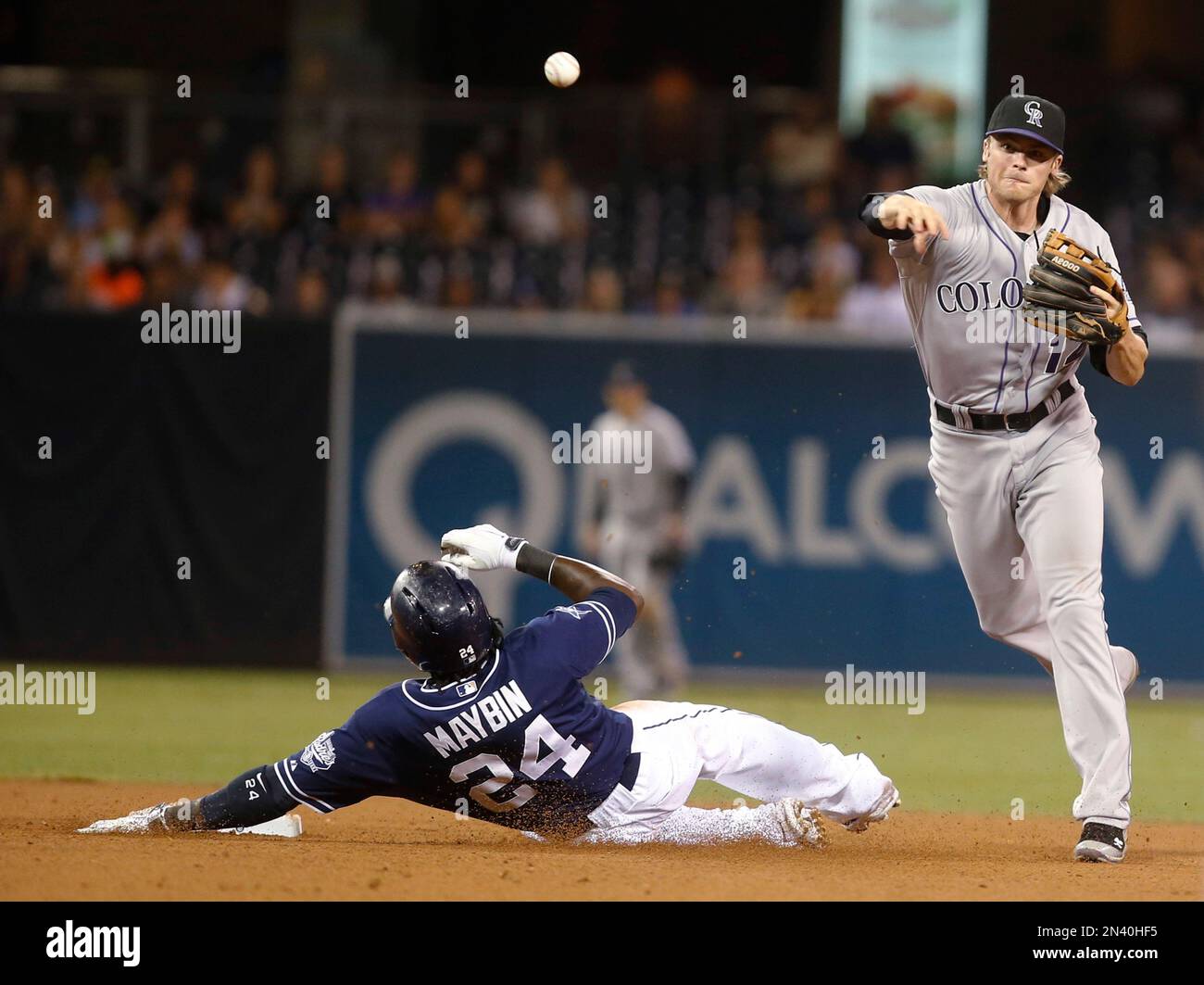 Colorado Rockies shortstop Josh Rutledge relays to first after avoiding ...