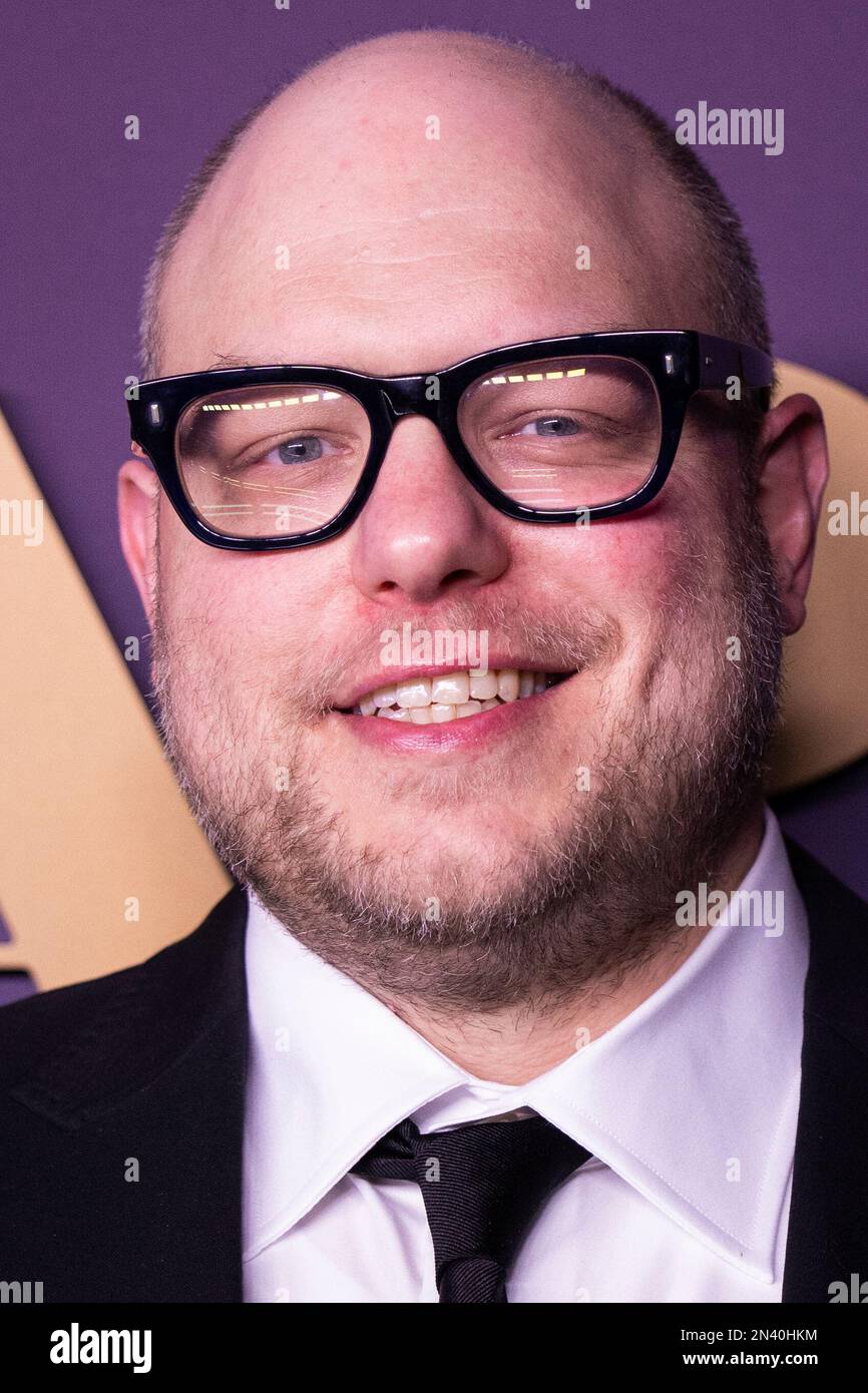 Writer/Producer Brian Gatewood poses for photographers upon arrival for ...