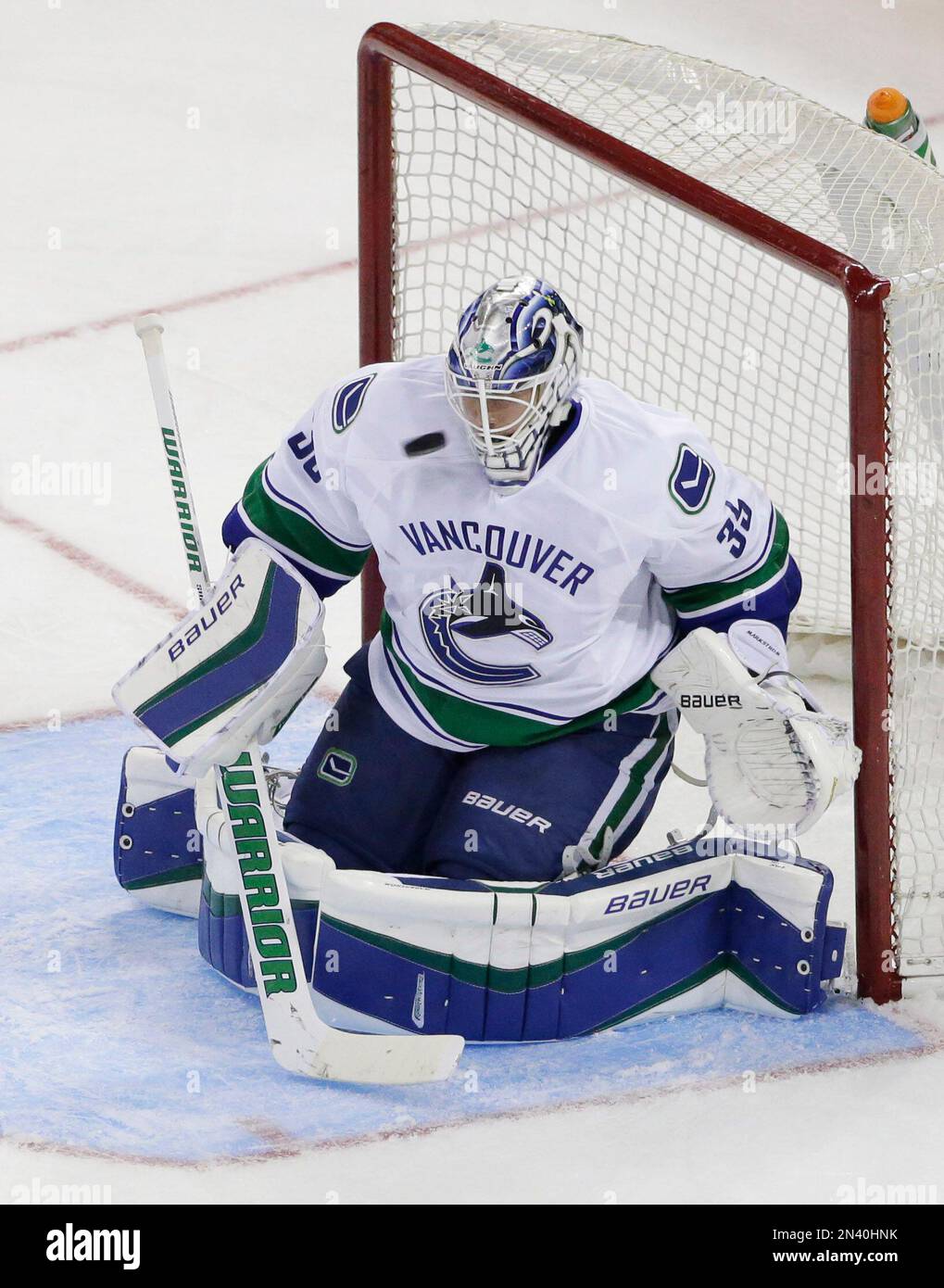 Vancouver Canucks goalie Jacob Markstrom, of Sweden, stops a shot by ...