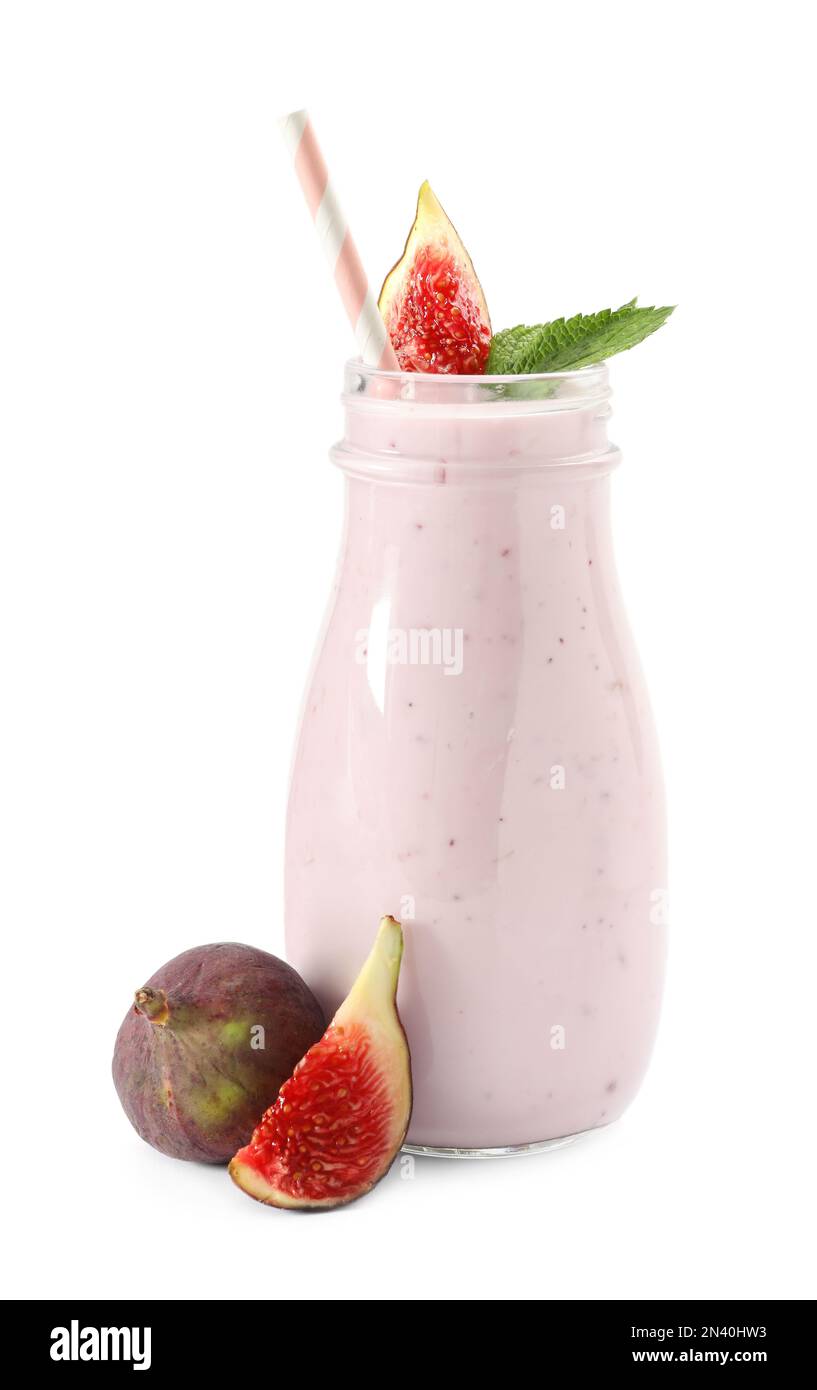 Delicious fig smoothie in glass bottle on white background Stock Photo ...