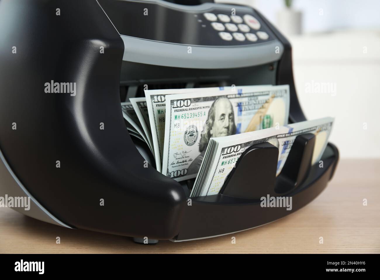 Modern electronic bill counter with money on table, closeup Stock Photo ...