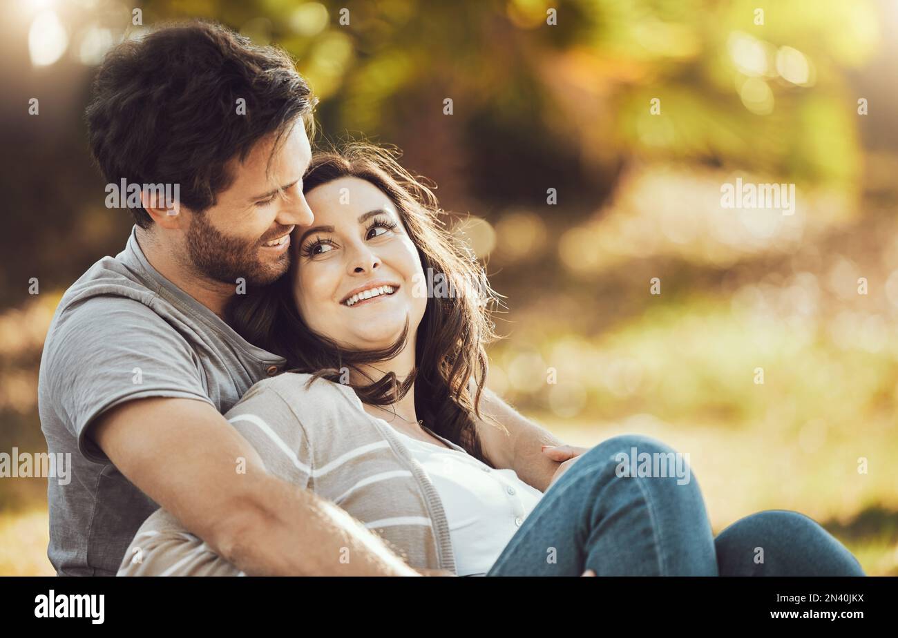Love, couple and relax at park, laughing at funny joke or comic comedy ...