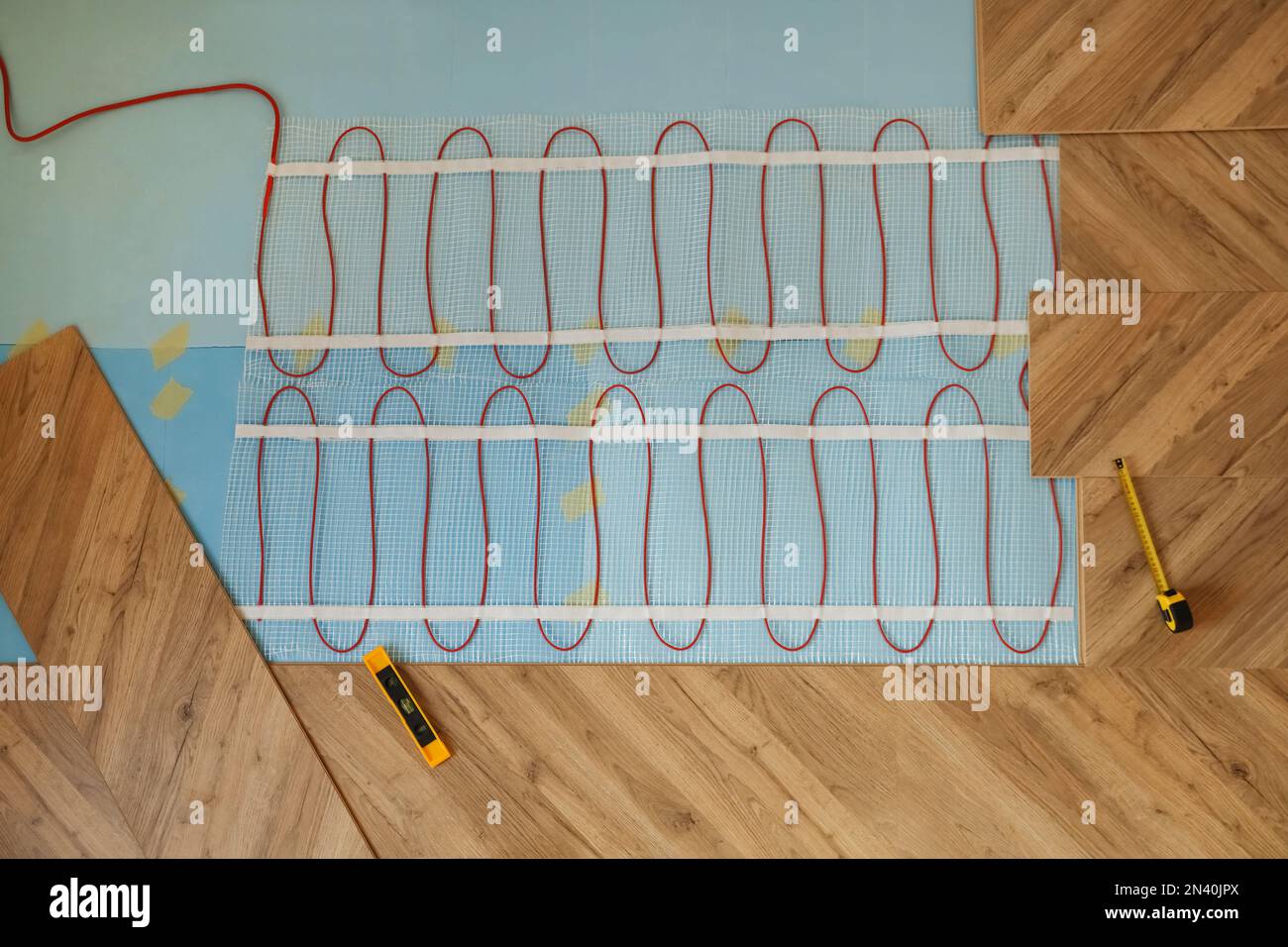 Installation of electric underfloor heating system indoors, top view ...