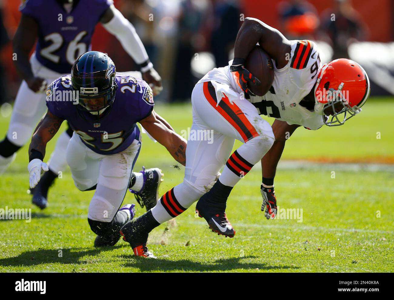 Baltimore Ravens cornerback Asa Jackson (25) trips up Cleveland Browns ...