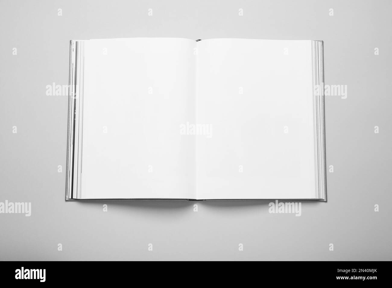 Open book with hard cover on white background, top view Stock Photo - Alamy