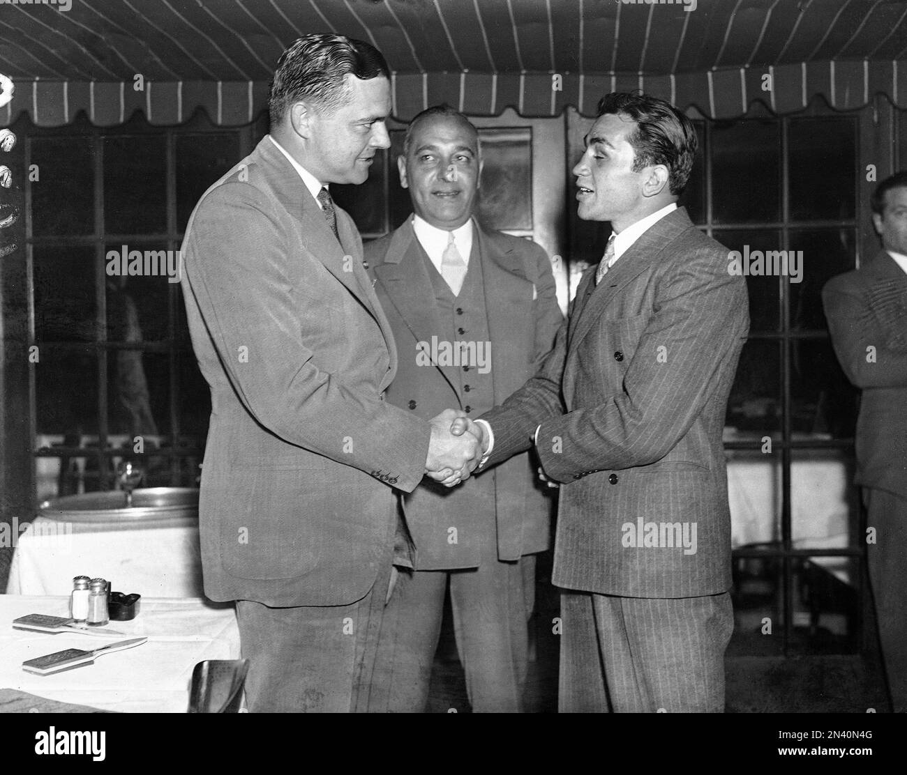 Officers of the Chicago Boxing Commission congratulate Barney Ross at ...