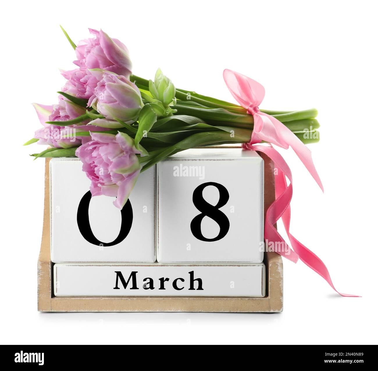 Wooden block calendar with date 8th of March and tulips on white ...