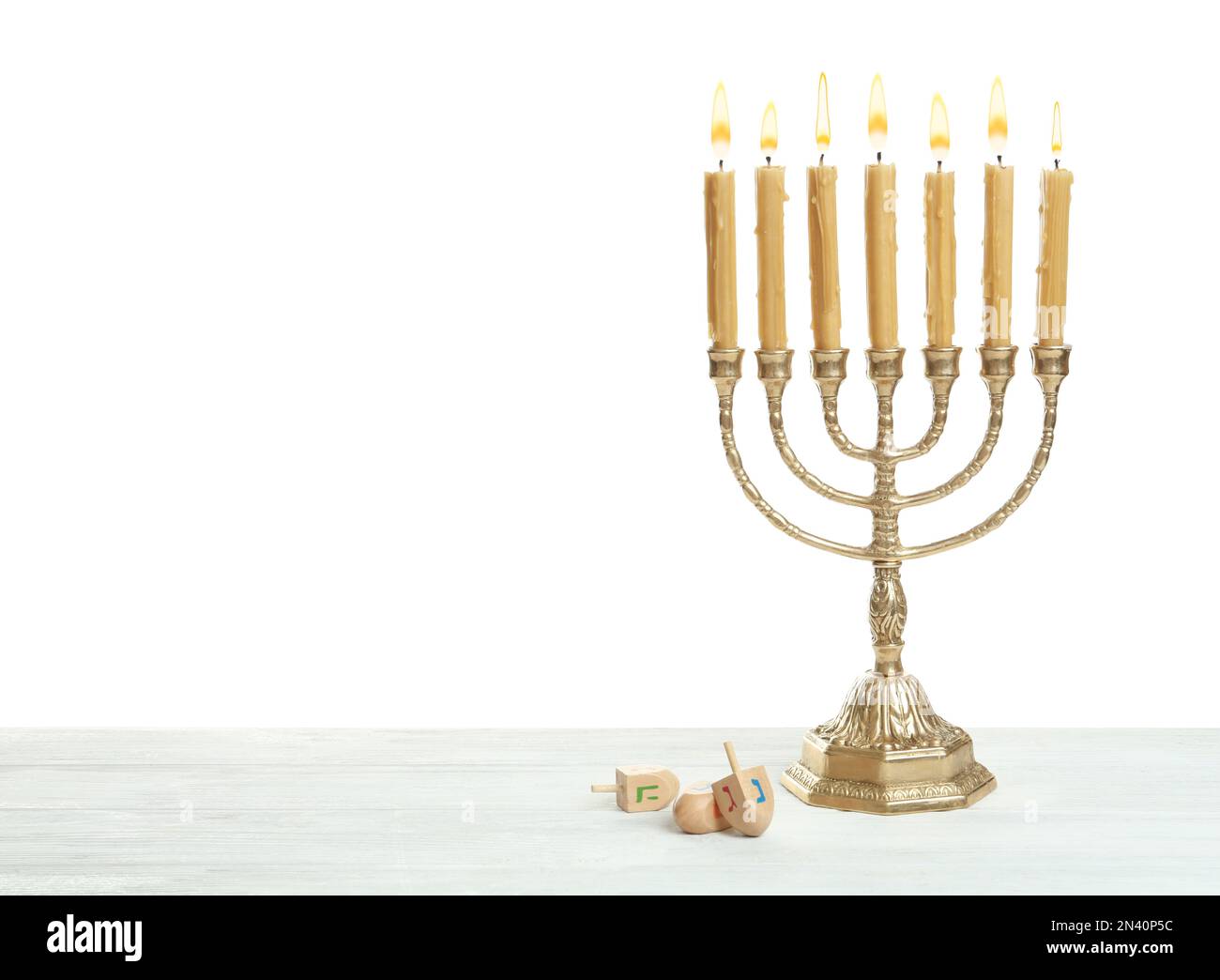 Golden menorah and Hanukkah dreidels with He, Gimel, Nun symbols on ...