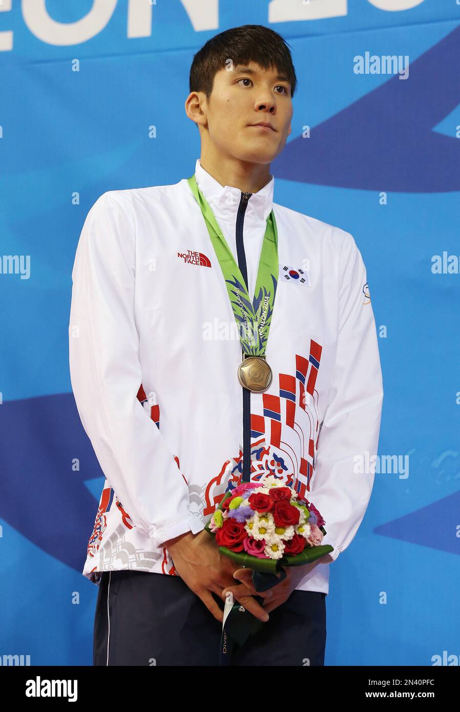 South Korea's Park Tae-whan stands on the podium with his bronze medal ...