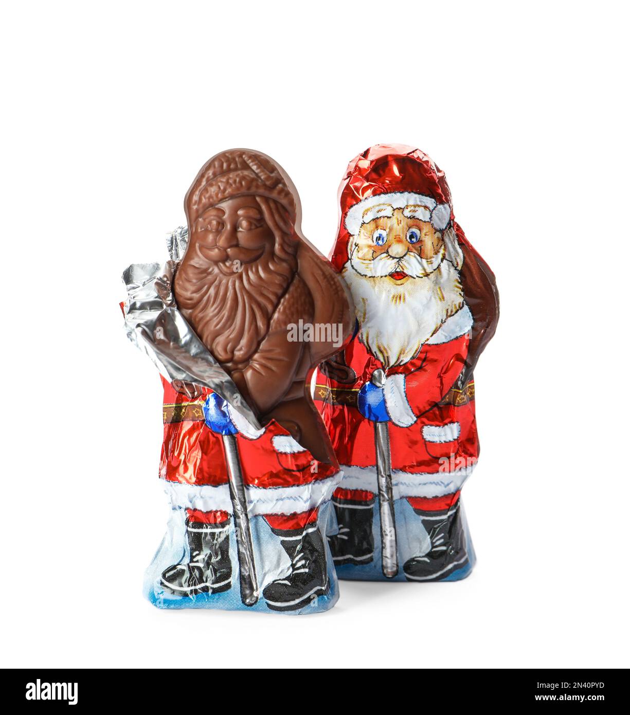 Sweet chocolate Santa Claus candies in foil wrappers on white ...