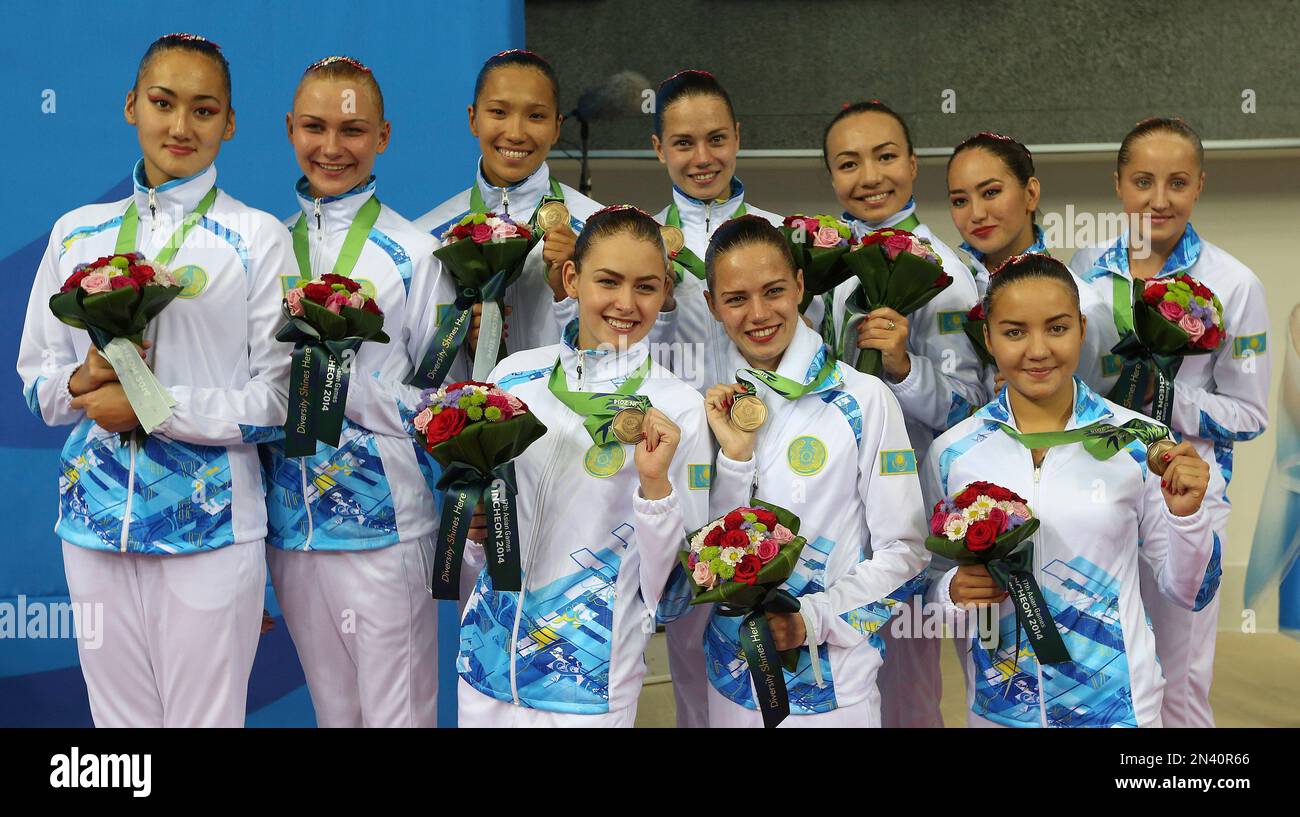 kazakhstan's synchronized swim team pose for a photo after they won ...