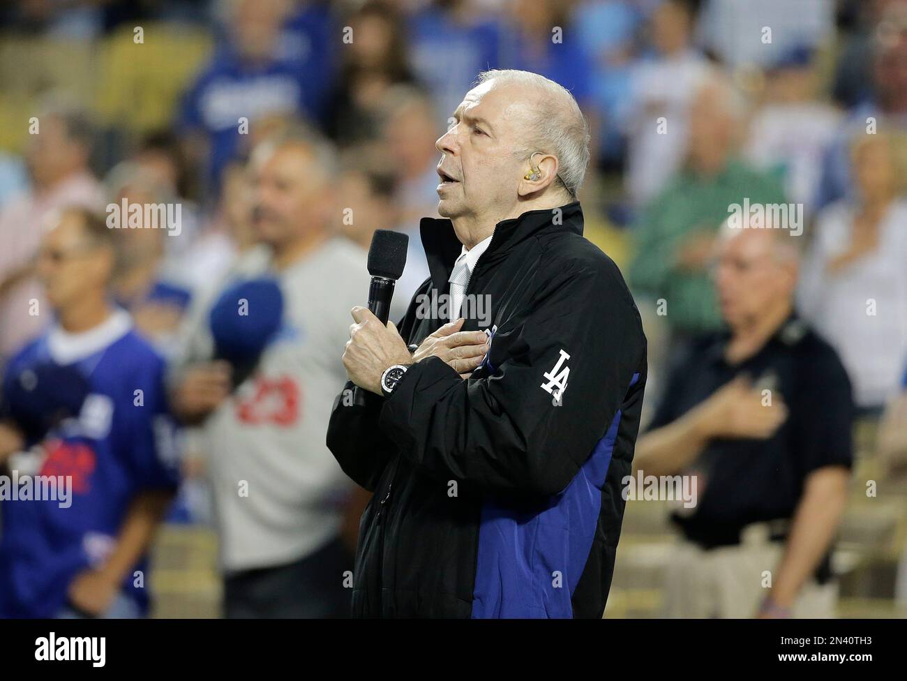 Frank Sinatra Jr. sings the national anthem before a baseball game ...