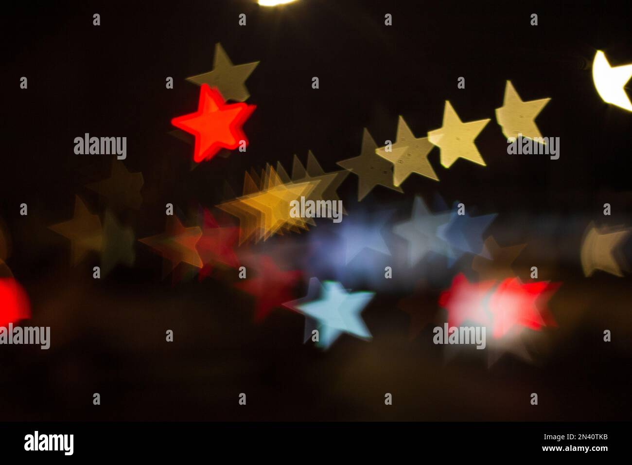 Star shape background bokeh blurred,many objects, colored red yellow ...