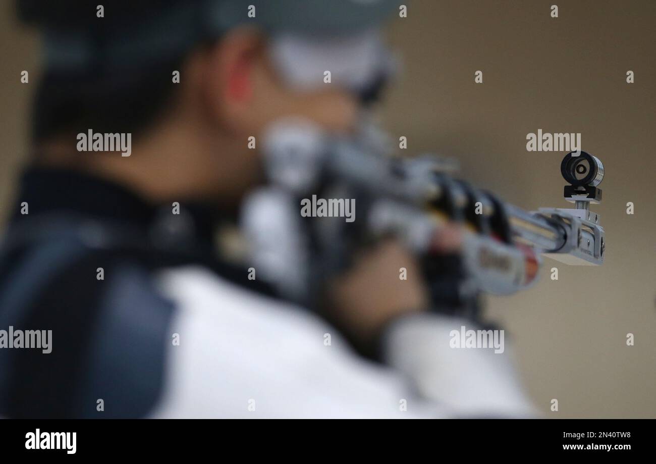China's Yang Haoran aims to shoot the target at the Men's 10m Air Rifle ...