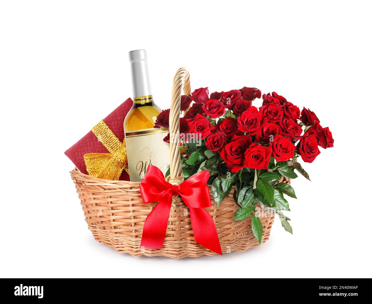 Wicker basket with gifts on white background Stock Photo - Alamy