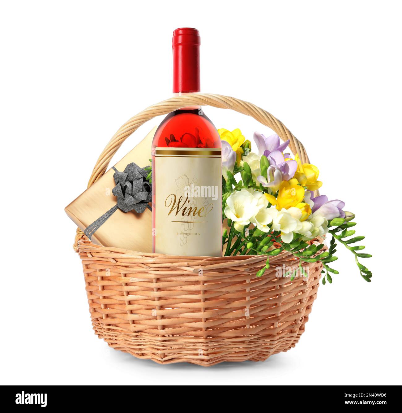 Wicker basket with gifts on white background Stock Photo - Alamy