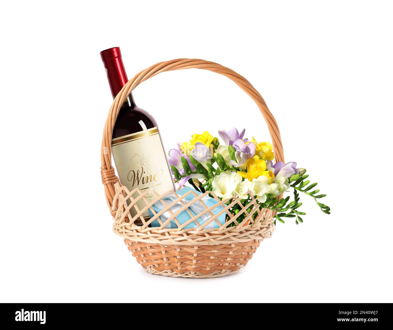 Wicker basket with gifts on white background Stock Photo - Alamy