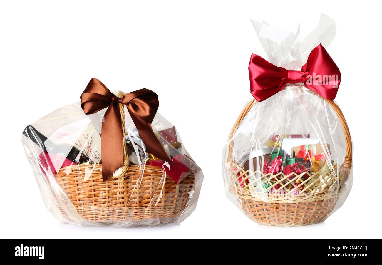 Wicker baskets full of different gifts on white background Stock Photo ...