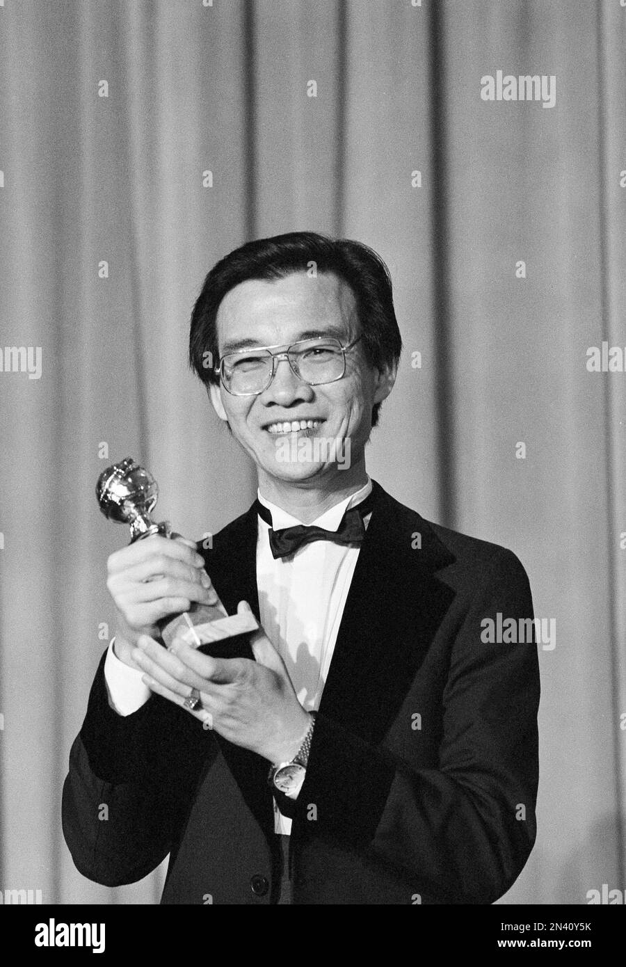 Dr. Haing S. Ngor holds his Golden Globe award for Best Performance by ...