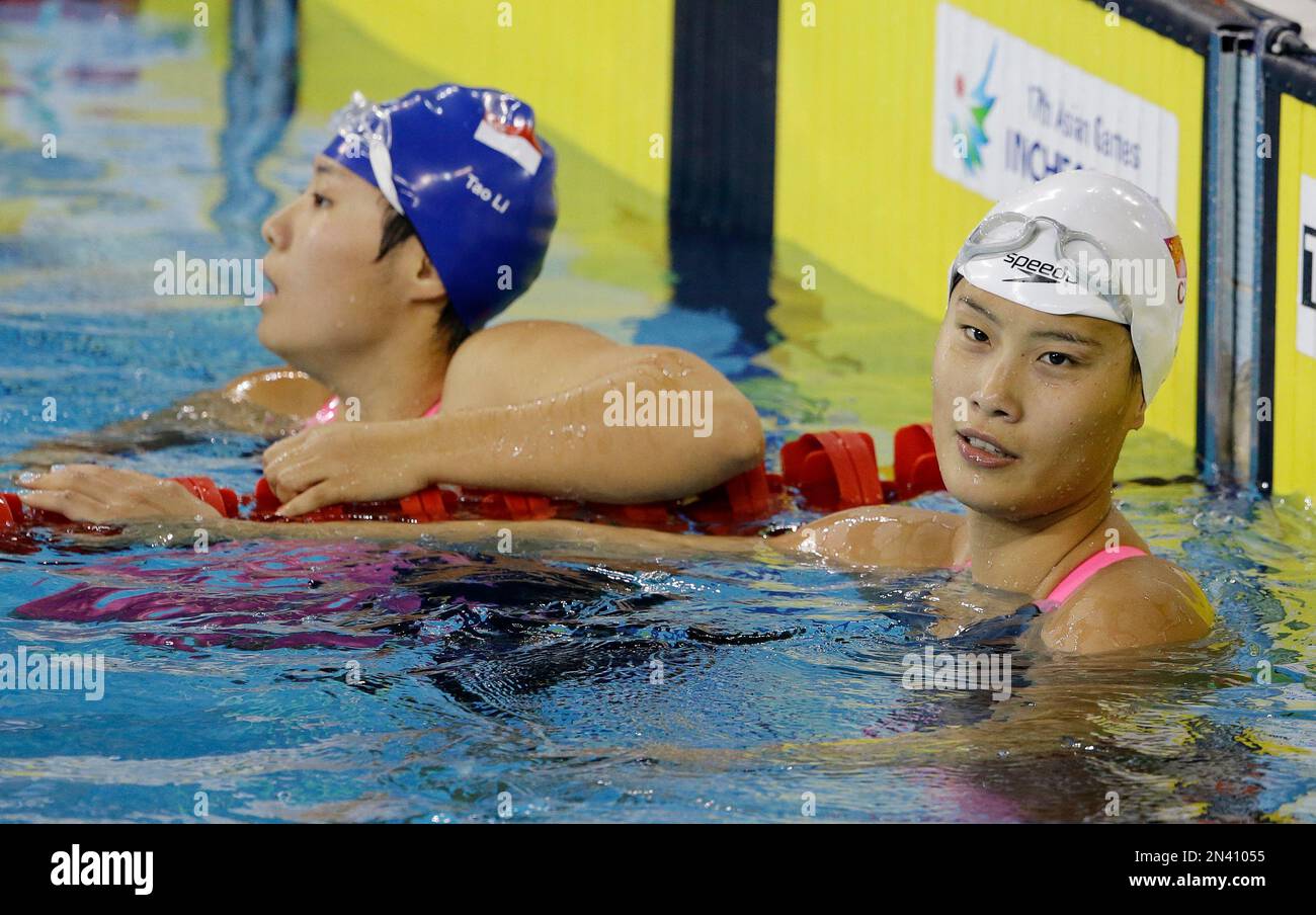 China's Lu Ying, right, waits in the pool with Singapore's Li Tao after ...