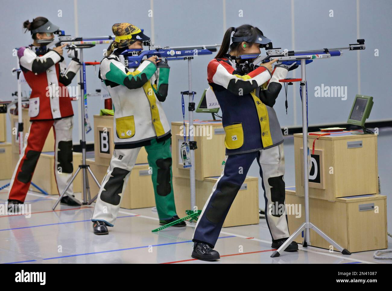 China's Zhang Binbin, right, competes the Women's 10m Air Rifle ...