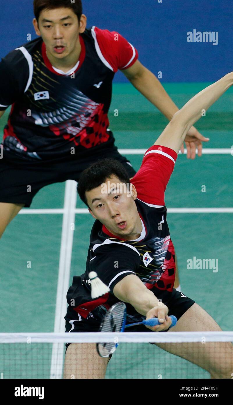 South Korea’s Yoo Yeon-seong, front, and Lee Yong-dae return a shot to ...