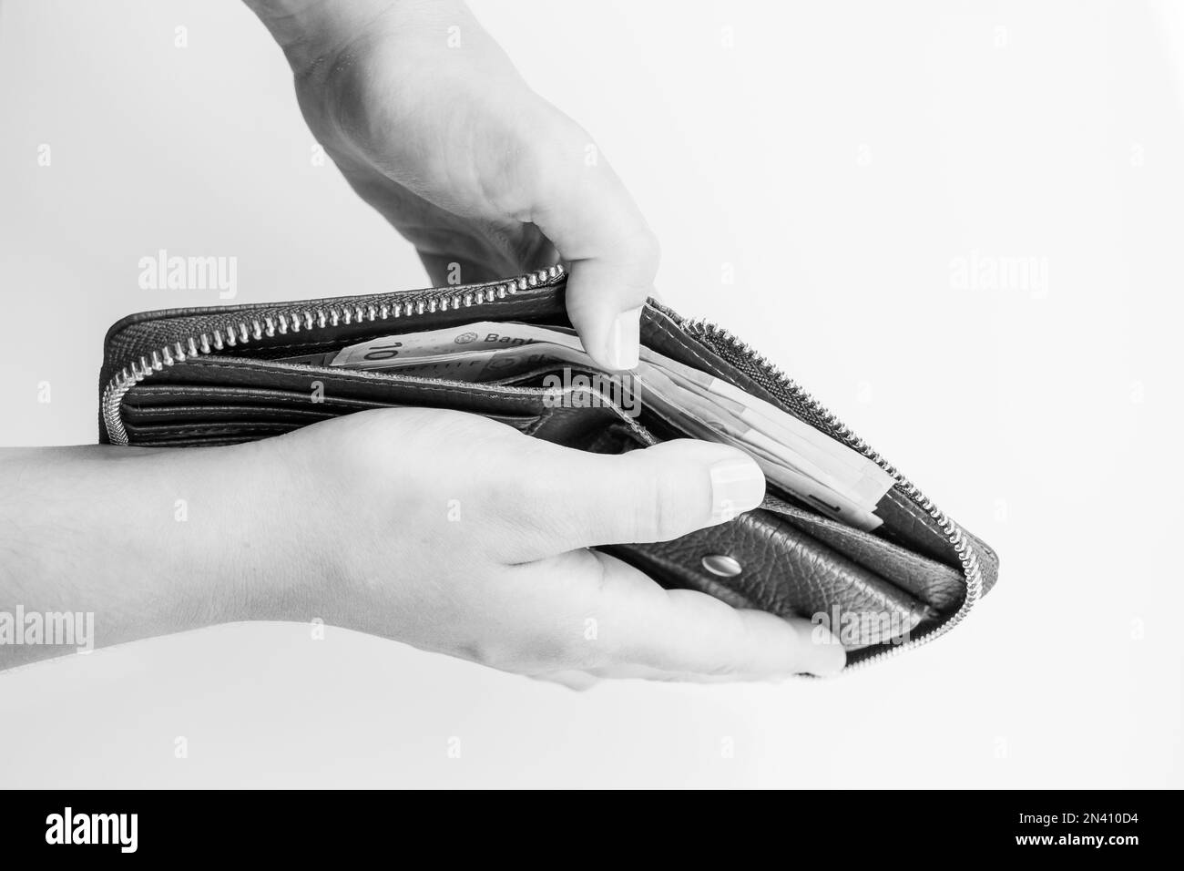 Female hands taking money out of a wallet on a white background Stock ...
