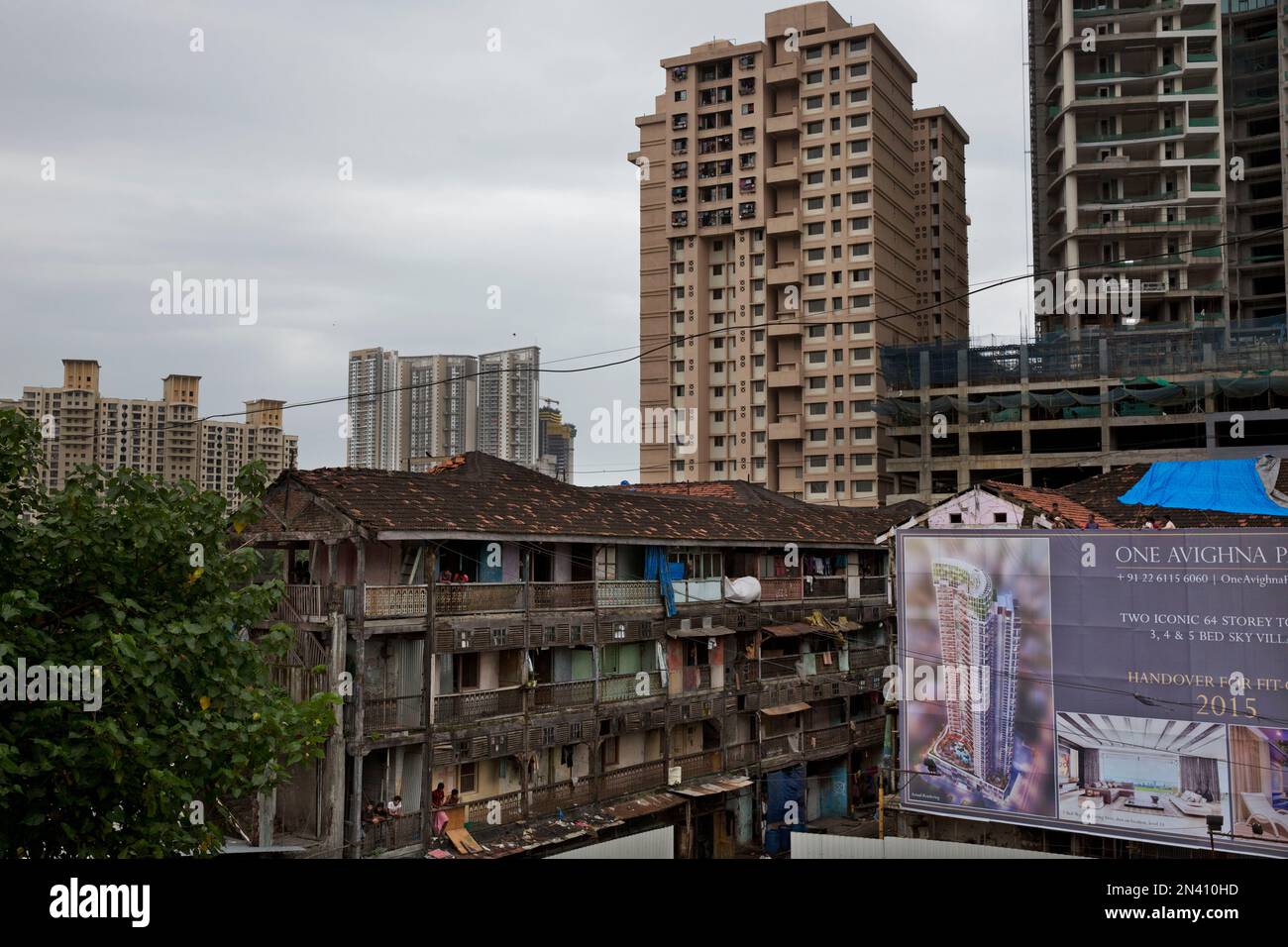 In this Sept. 8, 2014 photo, residents of a chawl, a large building ...