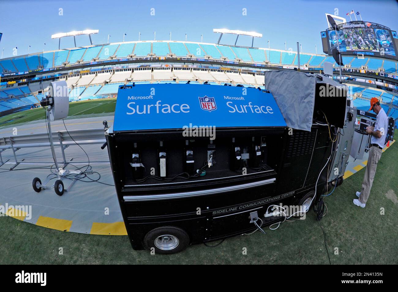 A team official works on the Carolina Panthers' communication system ...