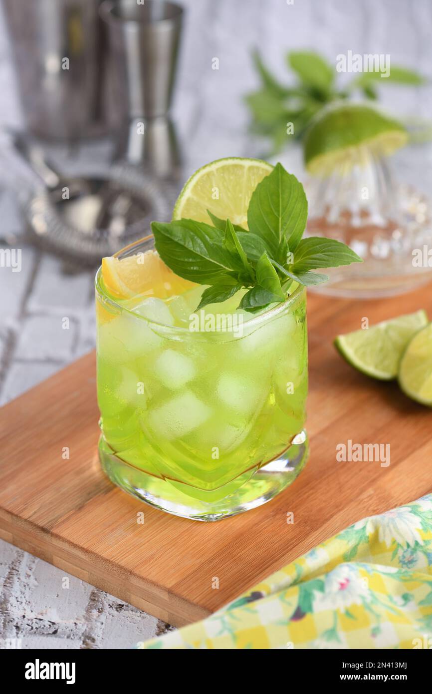 Thai basil smash cocktail and lemon. Refreshing organic gin drink Stock ...