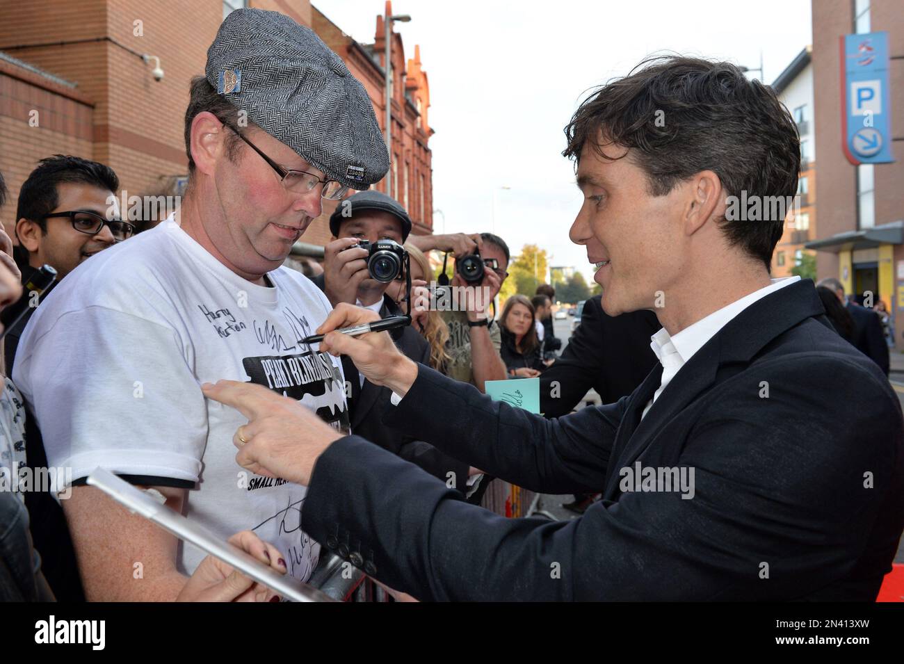 Actor Cillian Murphy signs autographs as he arrives for the premiere of ...