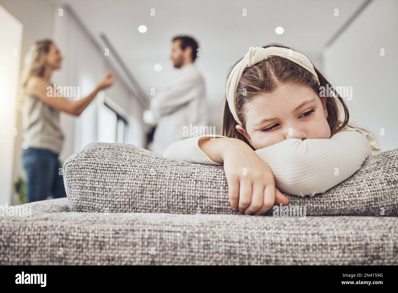 Sad little girl, sofa and parents in conflict, disagreement or fight in ...