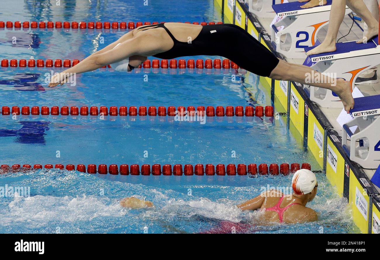 China's Tang Yi dives over teammate Zhang Yufei for the final leg of ...