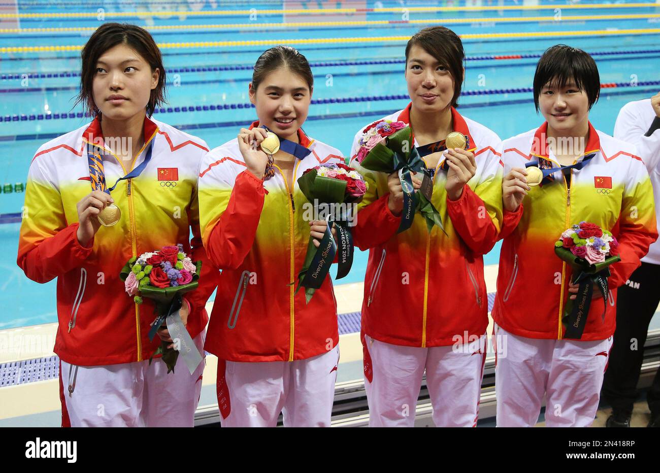Members of the Chinese women's 4x100 meters freestyle relay team, from ...