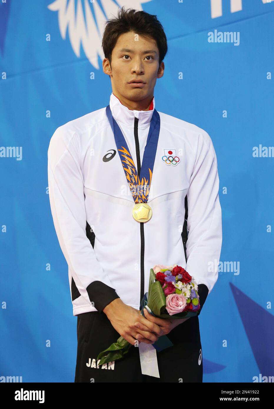 Japan's Ryosuke Irie stands on the podium after receiving his gold ...