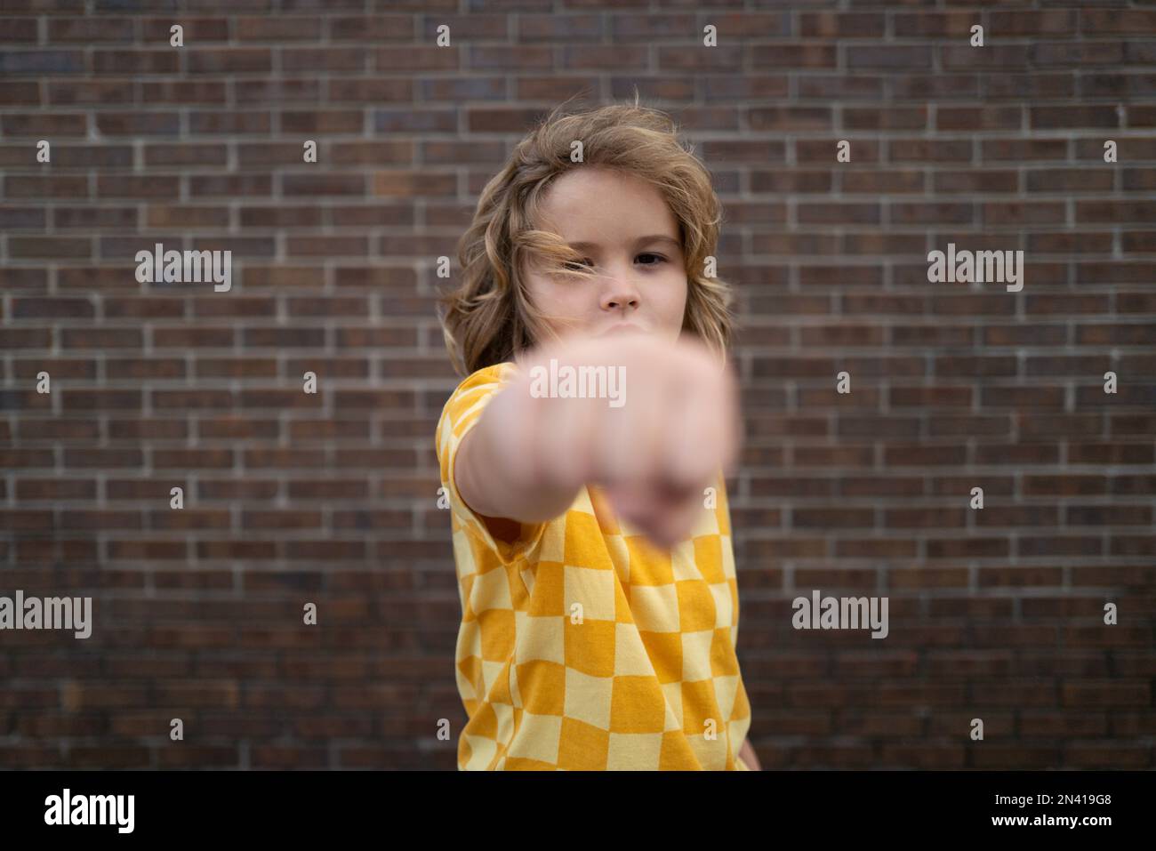Child with angry expression. Angry hateful little aggression boy, child ...