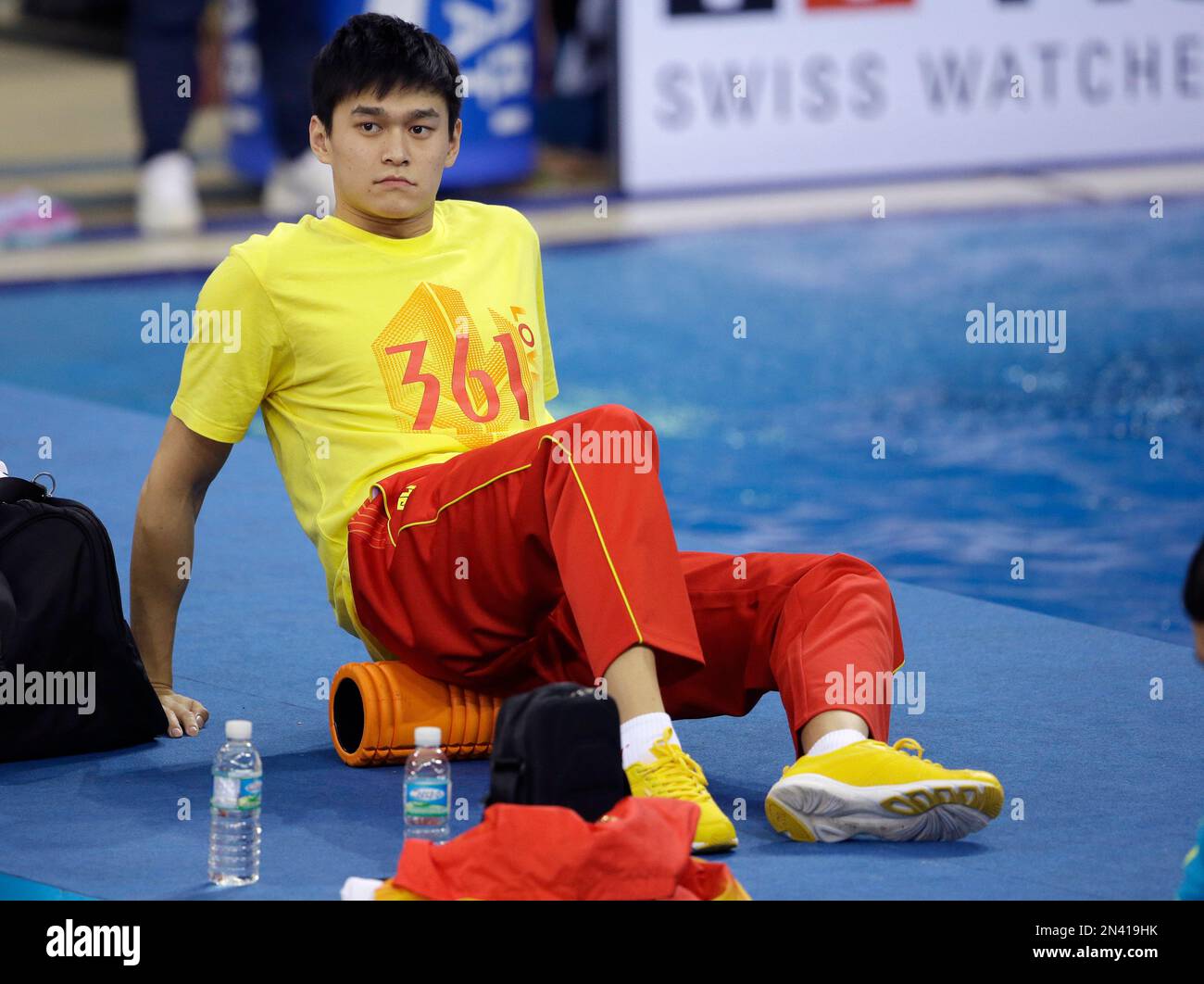 China's Sun Yang stretches during a warm-up ahead of the men's 200 ...