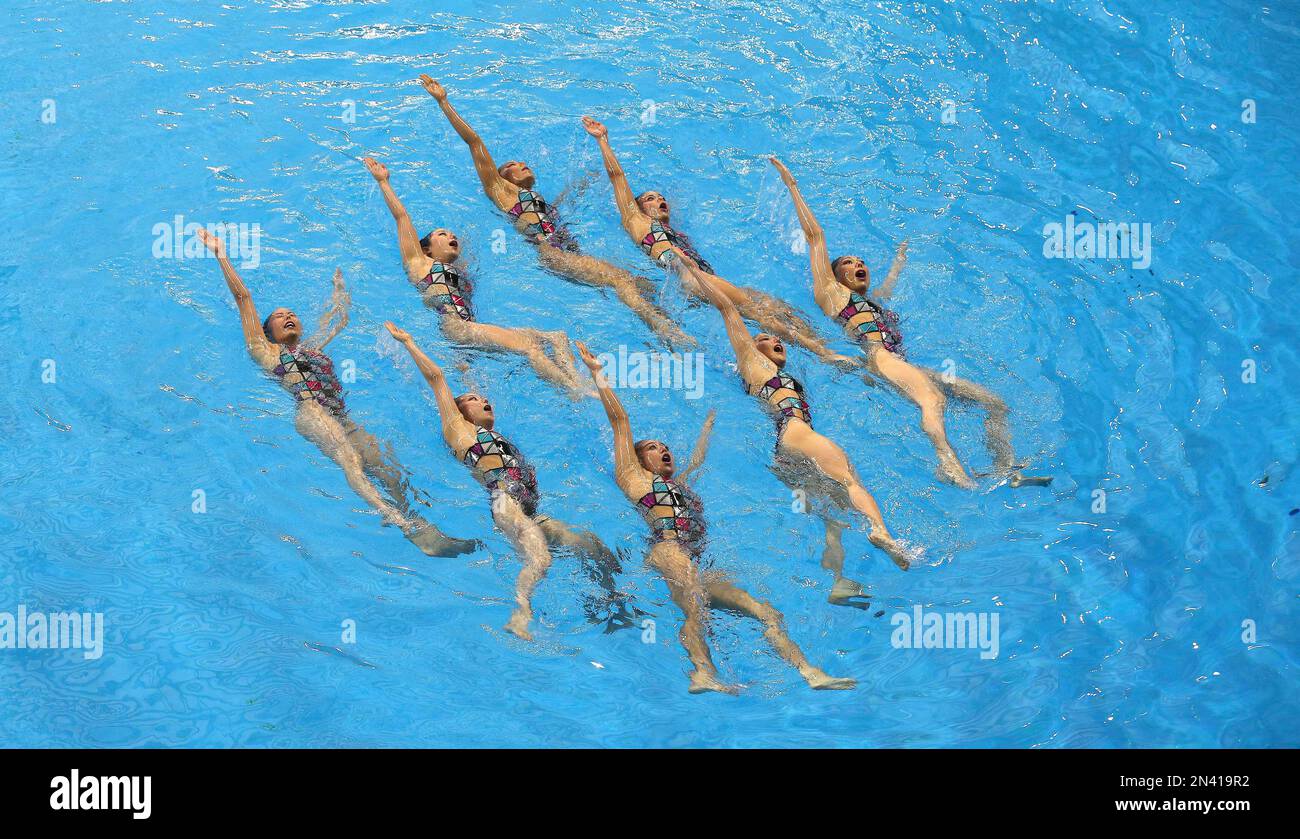 Japan's synchronized swimming team perform their technical routine at ...