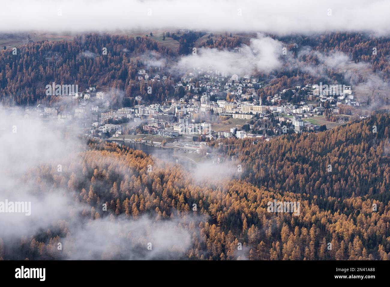 An aerial view of the Engadin with the forested mountains in autumn ...