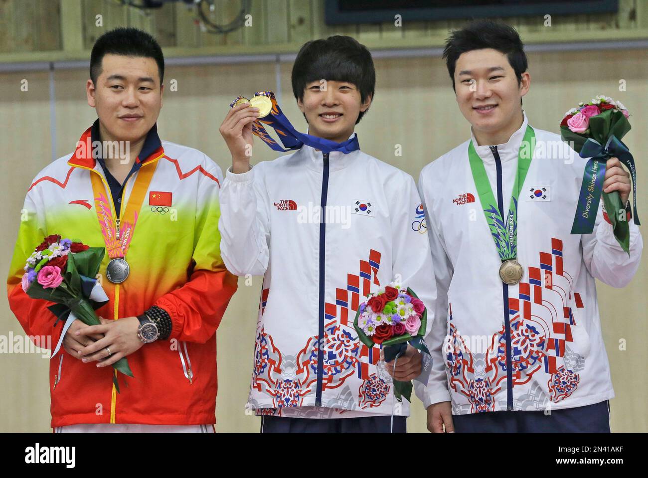 Medalists, from left to right, silver, Pang Wei of China, gold, Kim ...