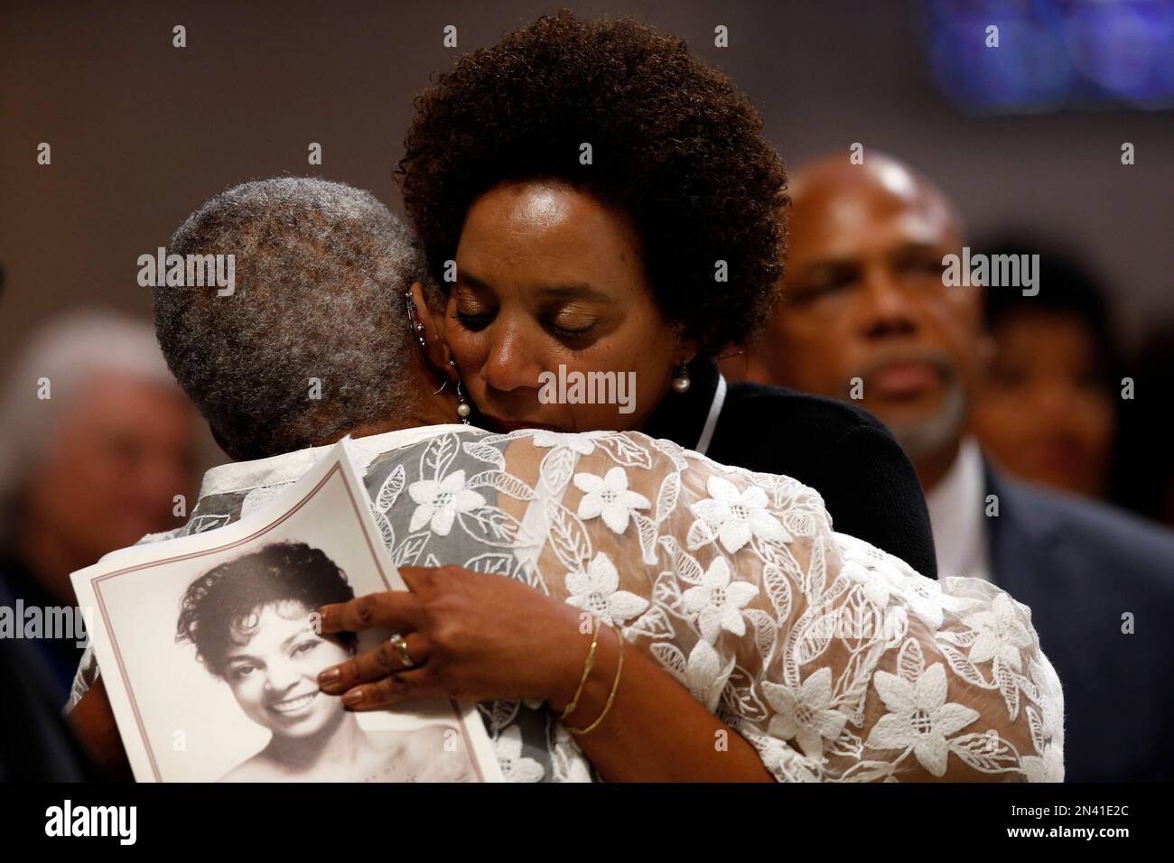 Hasna Muhammad, facing, embraces her sister Nora Davis Day during a ...