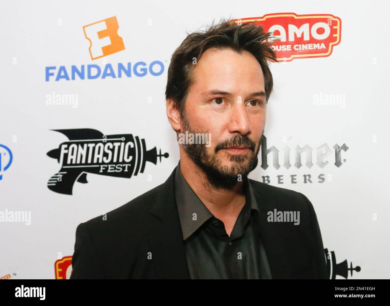 Keanu Reeves walks the red carpet before an advance screening of his ...