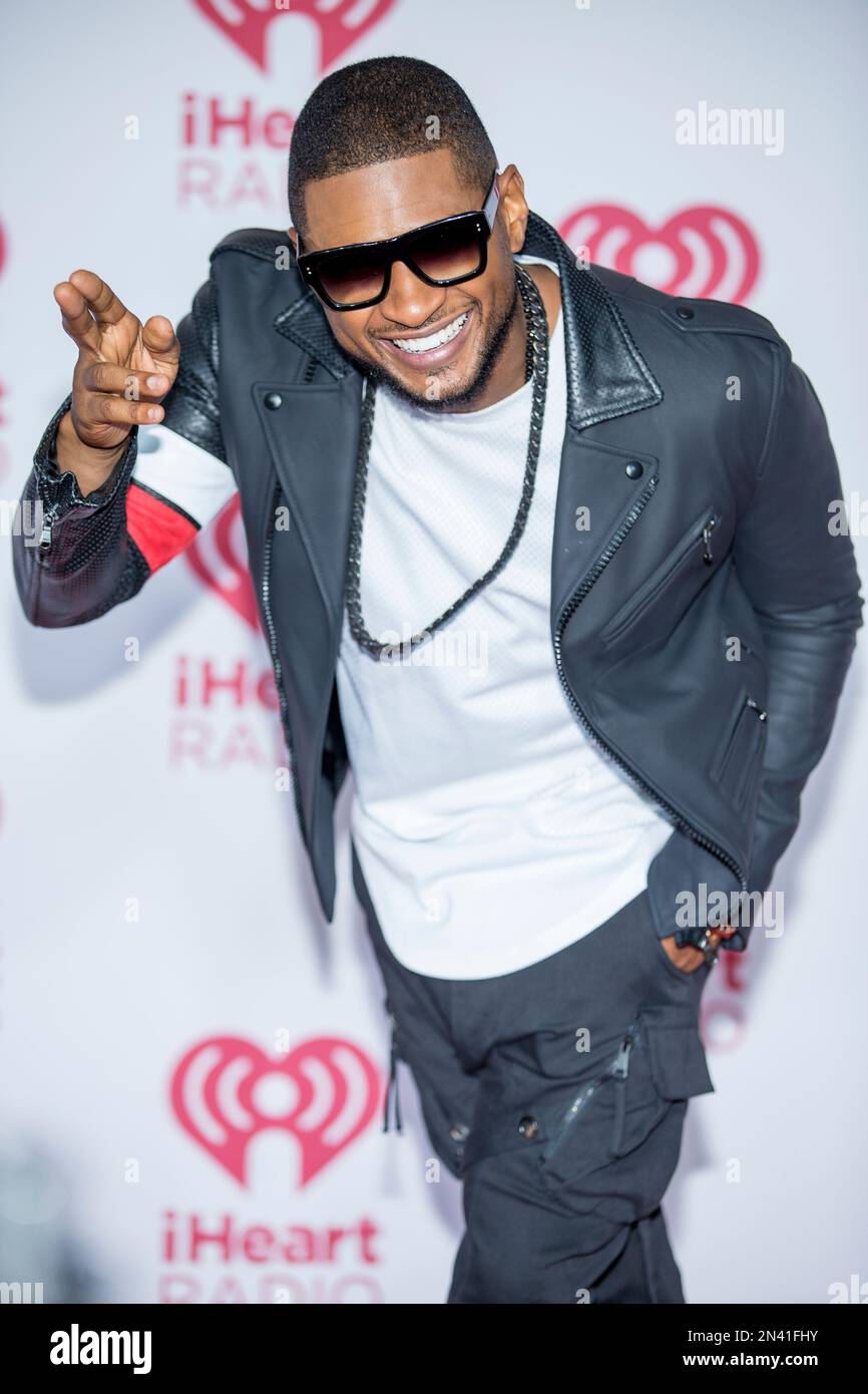 Usher arrives at the iHeartRadio Music Festival, Friday Sept. 19, 2014 ...