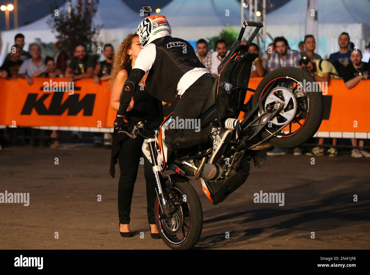 Slovenian KTM stunt rider Rok Bagoros, right, performs on his ...