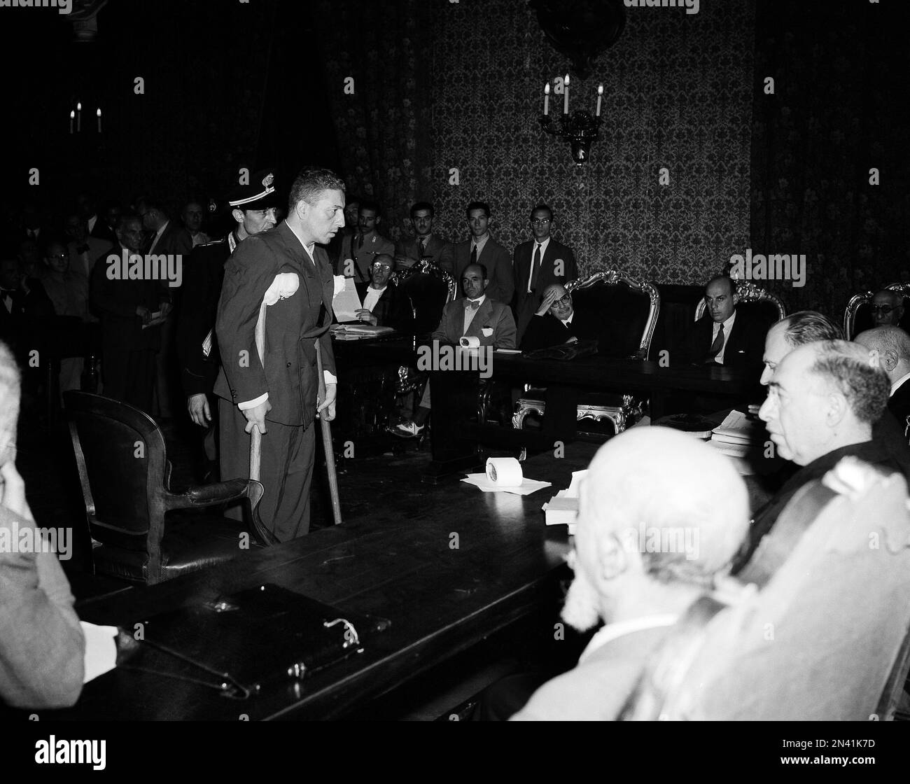 Walking on crutches, former Roman chief of police Pietro Caruso comes ...