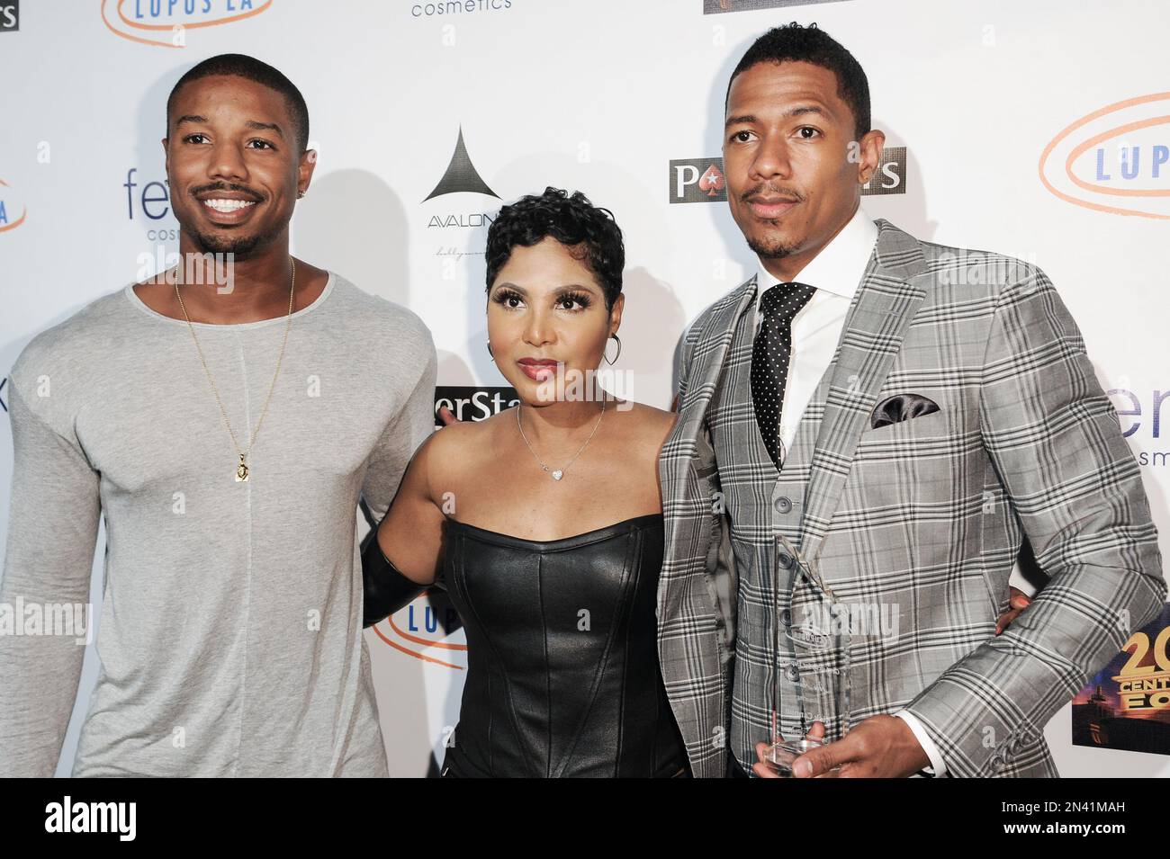 From left, Michael B. Jordan, Toni Braxton, and Nick Cannon arrive at ...